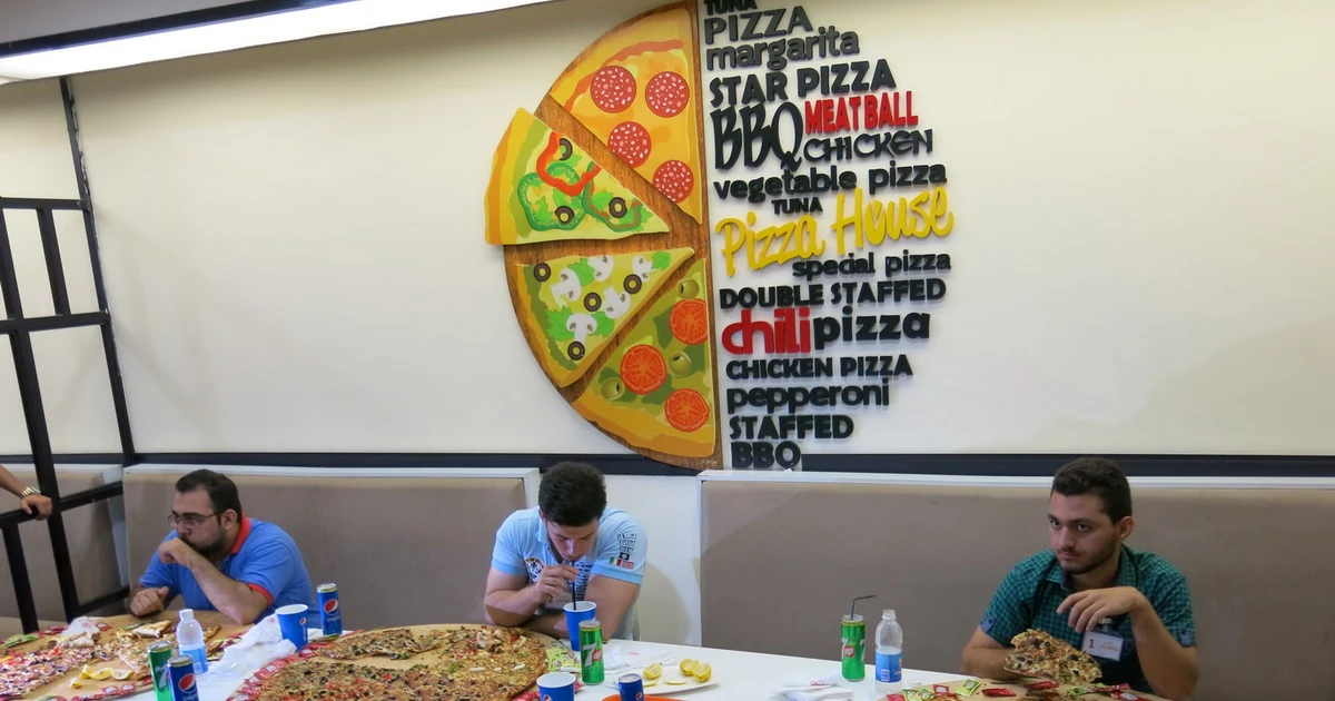[Photo] Độc đáo cuộc thi ăn bánh pizza khổng lồ ở Baghdad | Vietnam+ ...